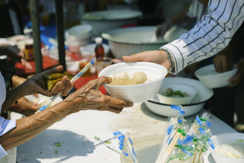 The Concept of Feeding : the Hands of the Poor Receive Food from the ...