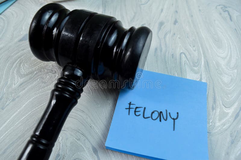 Concept of Felony Write on Sticky Notes with Gavel Isolated on Wooden ...