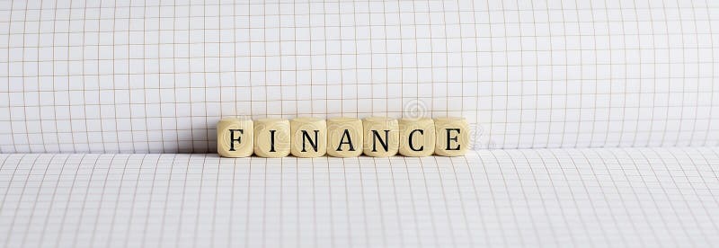 Concept FINANCE . Words Written on a Wooden Block on Notebook Stock ...