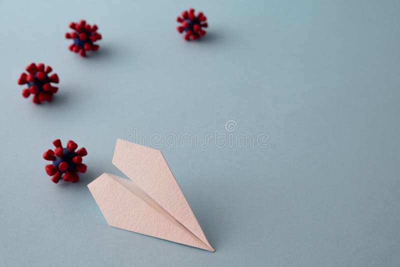 Concept of Fly Danger. Paper Plane and Models of Covid-19 Virus on Blue ...