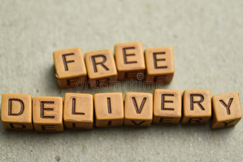 Concept of Free Delivery Message Written on Wooden Blocks. Cross ...