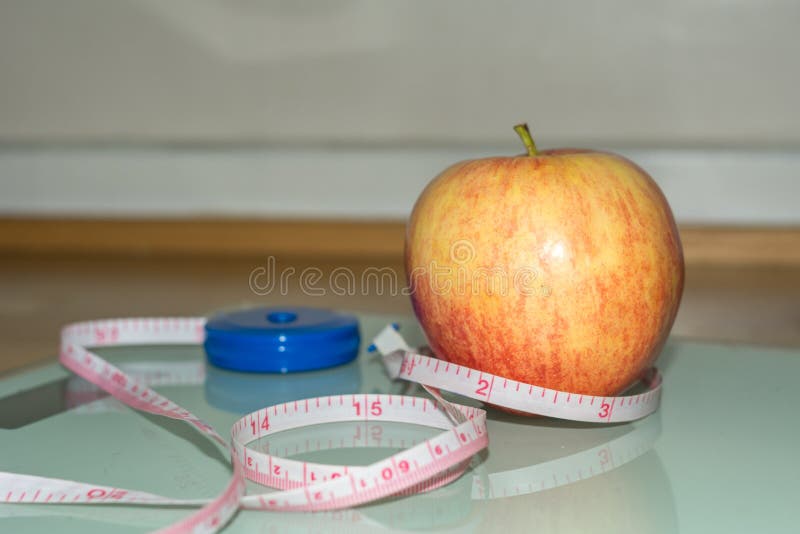 Concept - Getting in Shape, Measuring Tape, Apple, Scale Stock Photo ...