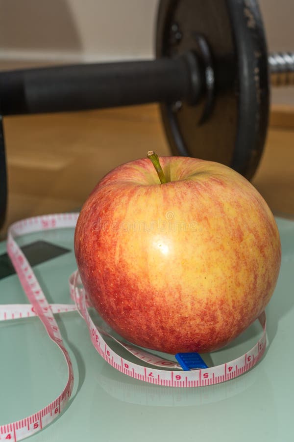 Concept - Getting in Shape, Measuring Tape, Apple, Scale and Dumbbell ...