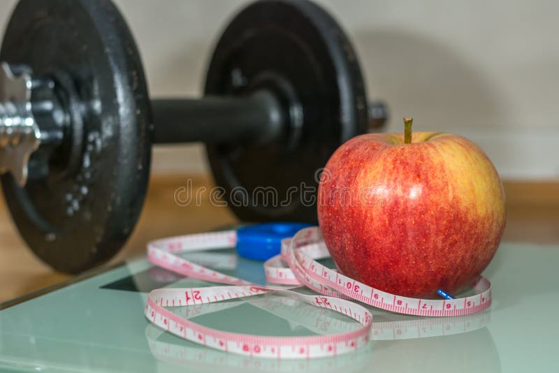 Concept - Getting in Shape, Measuring Tape, Apple, Scale and Dumbbell ...