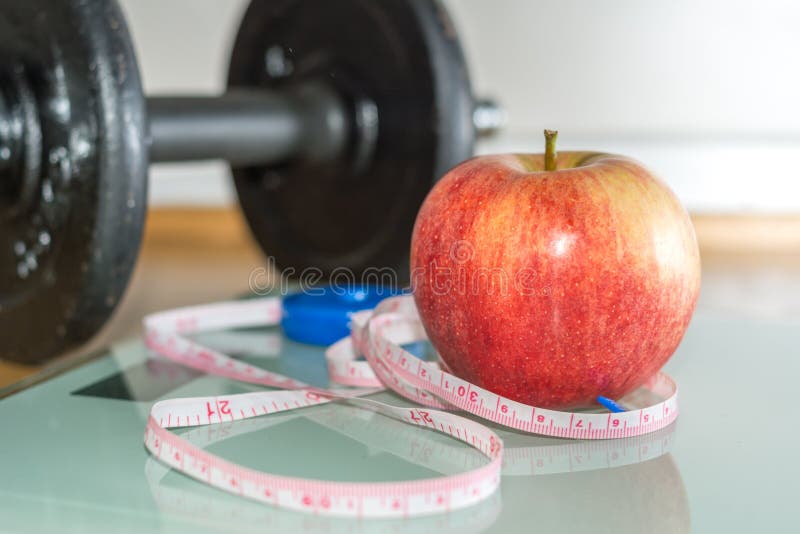 Concept - Getting in Shape, Measuring Tape, Apple, Scale and Dumbbell ...