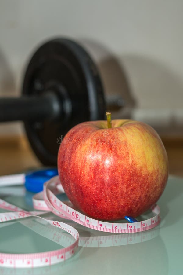 Concept - Getting in Shape, Measuring Tape, Apple, Scale and Dumbbell ...