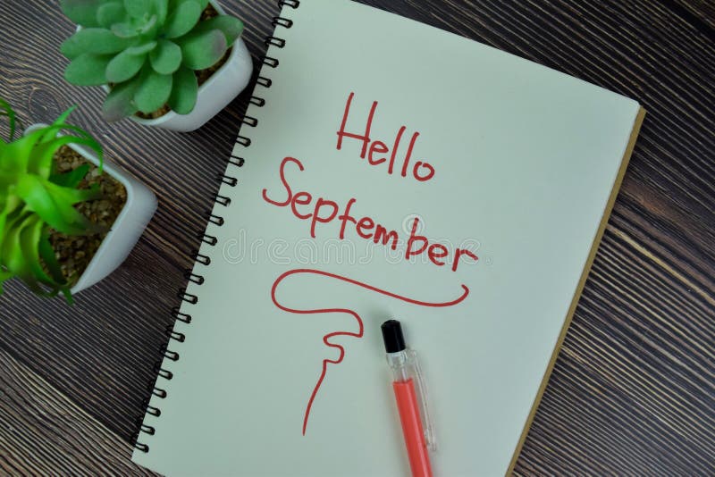 Concept of Hello September Write on a Book Isolated on Wooden Table ...