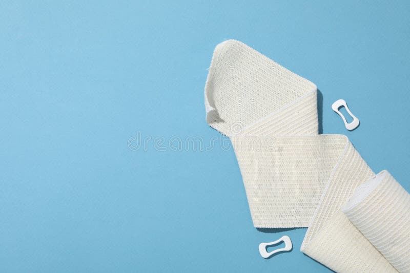 Concept of Help during an Injury, Elastic Bandage on Blue Background ...