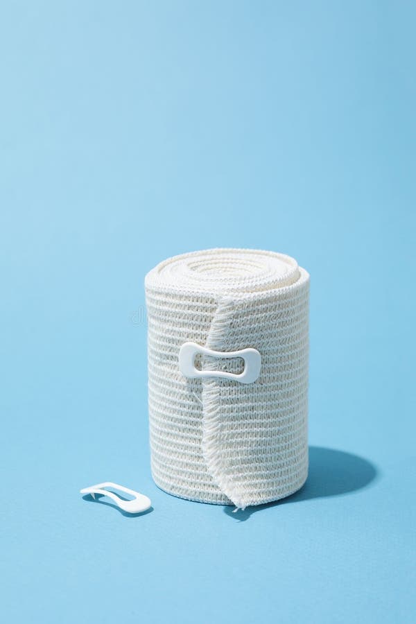 Concept of Help during an Injury, Elastic Bandage on Blue Background ...