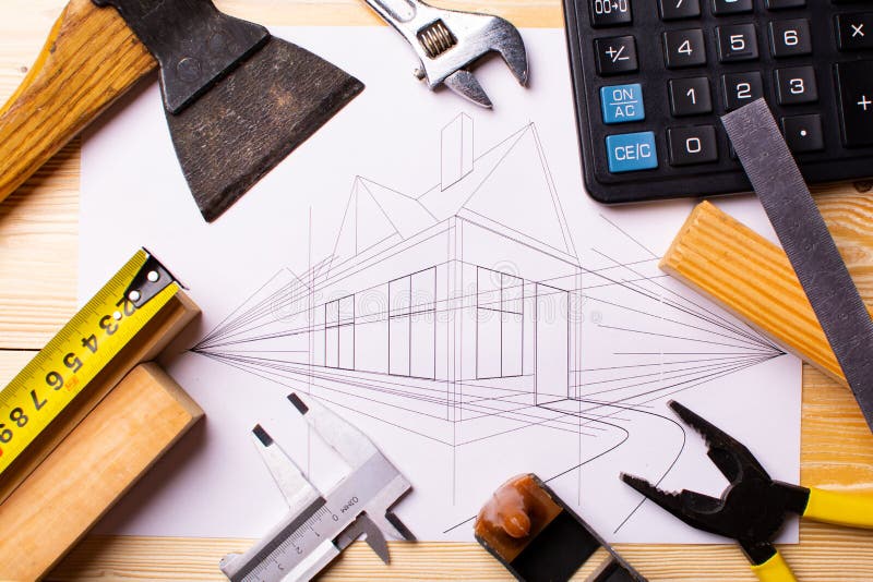 Concept of Home Improvement. a Set of Tools and a Drawing of the House ...