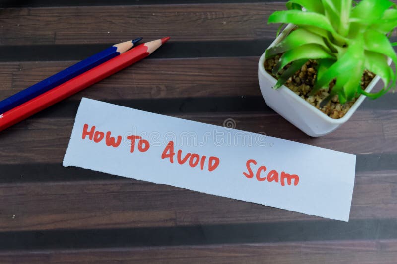 Concept of How To Avoid Scam Write on Sticky Notes Isolated on Wooden ...