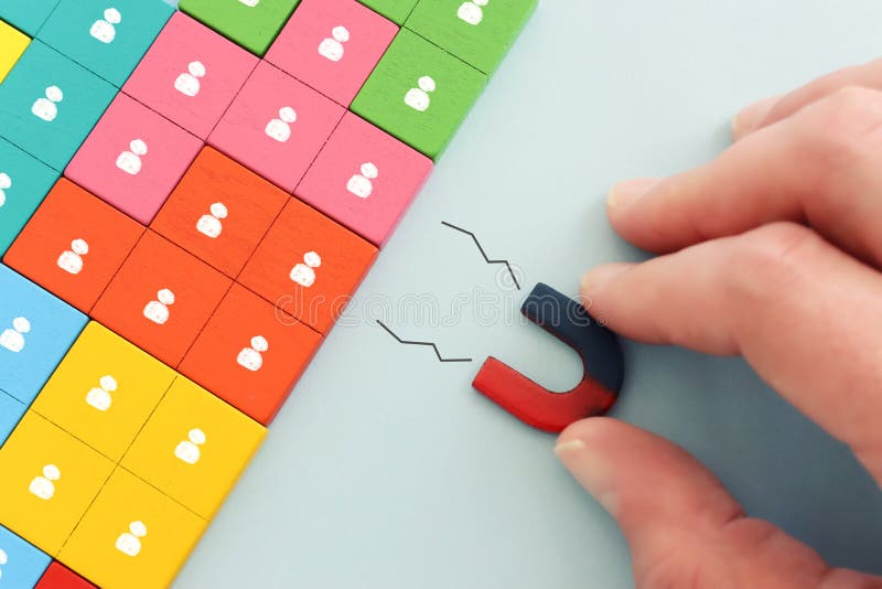 Concept Image of a Magnet Attracting a Group of People. Metaphor of ...