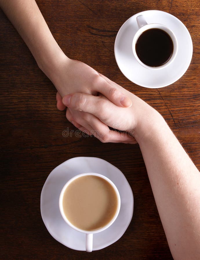 Couple in Love Holding Hands with Coffee on White Marble Table ...