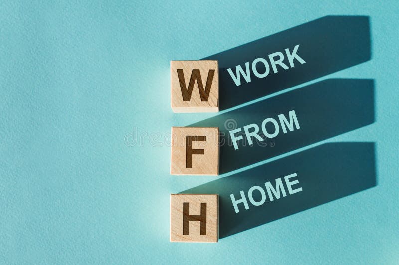 Concept Image a Wooden Block and Word WFH - WORK from HOME on Blue ...