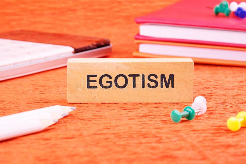 Concept Image. the Word EGOTISM on a Wooden Bar in Front of an Orange ...