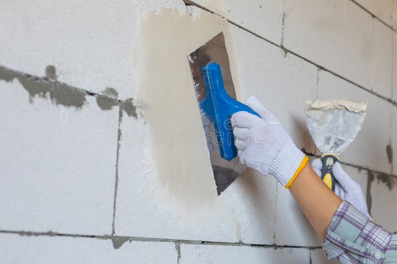 The Concept of Leveling the Surface of a Wall Using a Trowel Stock ...