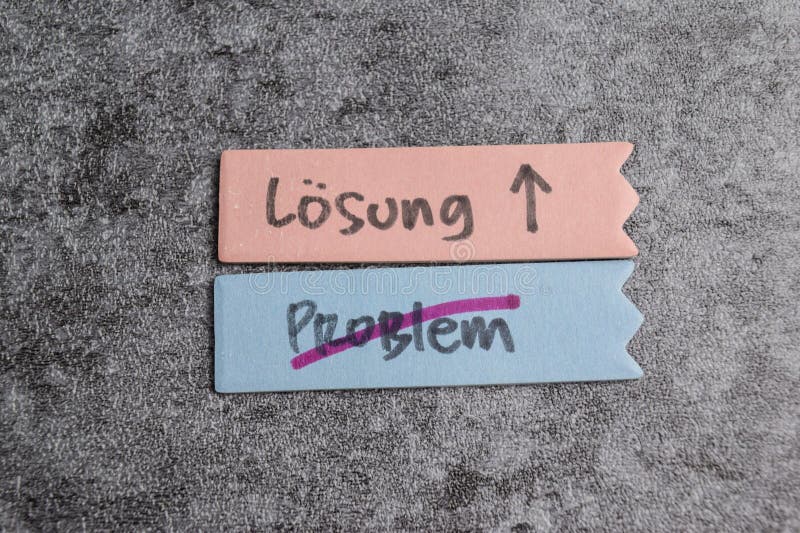 Concept of Losung Und Problem Write on Sticky Notes Isolated on Wooden ...