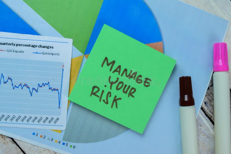 Concept of Manage Your Risk Write on Sticky Notes Isolated on Wooden ...
