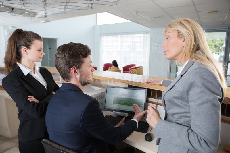 Concept Manager Questioning Receptionist Stock Image - Image of people ...