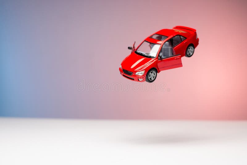 Concept New Car. Red Toy Car Flying Stock Image - Image of automobile ...