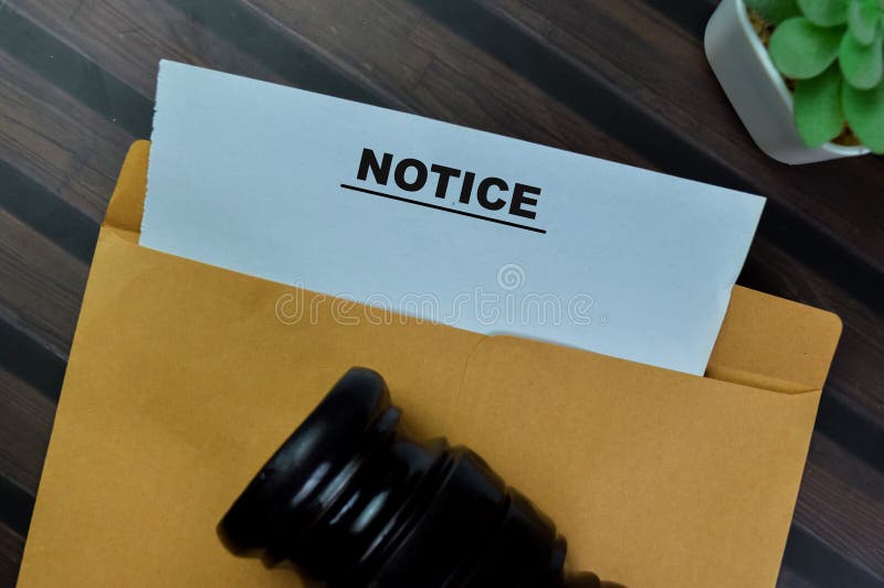 Concept of Notice Text on Document Above from Brown Envelope with Gavel ...