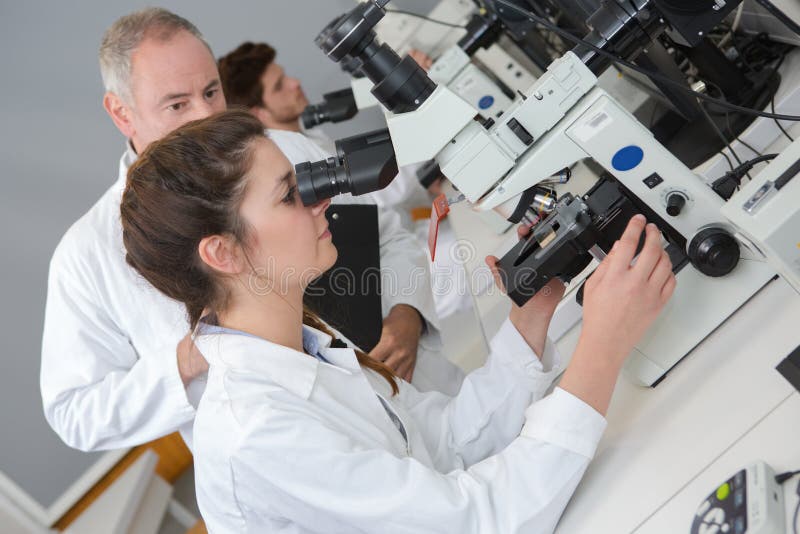 Concept Observation Under Microscope Stock Photo - Image of teenager ...