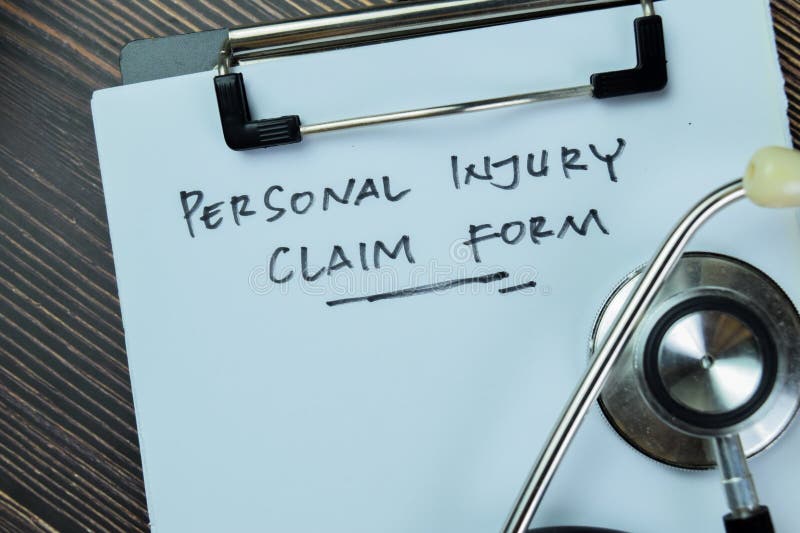 A Personal Injury Claim Form on a Clipboard, Accompanied by a ...
