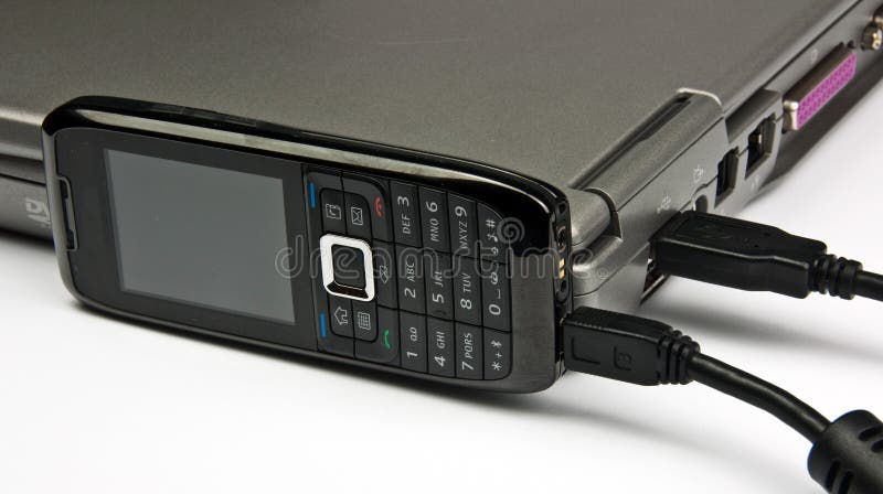 Concept Phone Connected To Laptop Via Usb Cable Stock Image - Image of ...