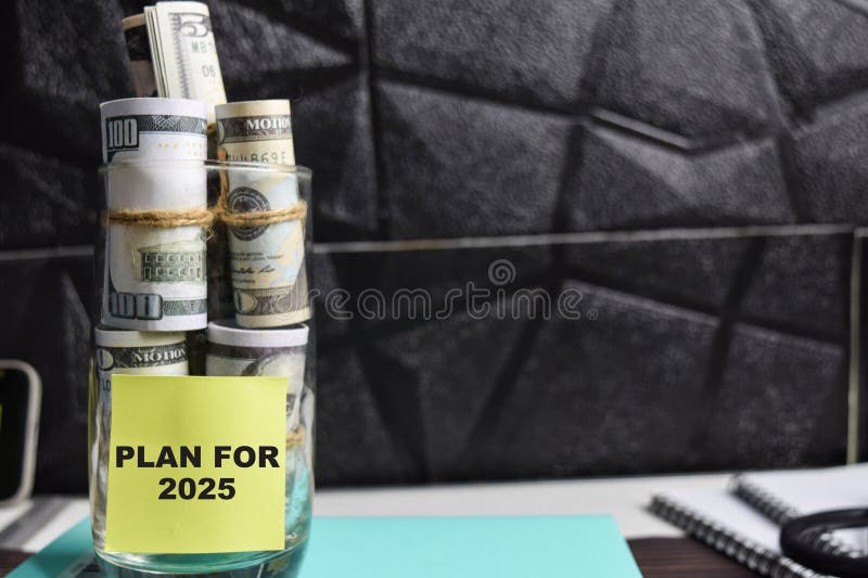 Concept of Plan for 2025 Write on Sticky Notes with Dollars in Glass ...