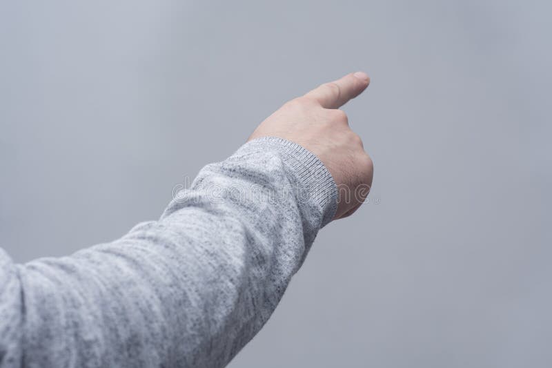 Concept of Pointing Finger. Close-up of a Man in a Sweater Pointing His ...