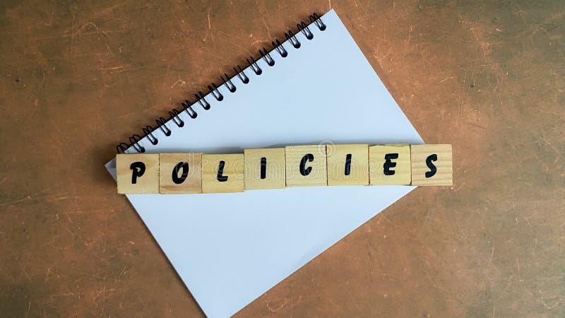 Concept of Policies Writing on Wooden Cube Isolated on Work Desk. Stock ...