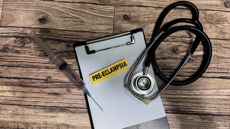 Concept of Pre-Eclampsia Write on Sticky Notes Isolated on Wooden Table ...