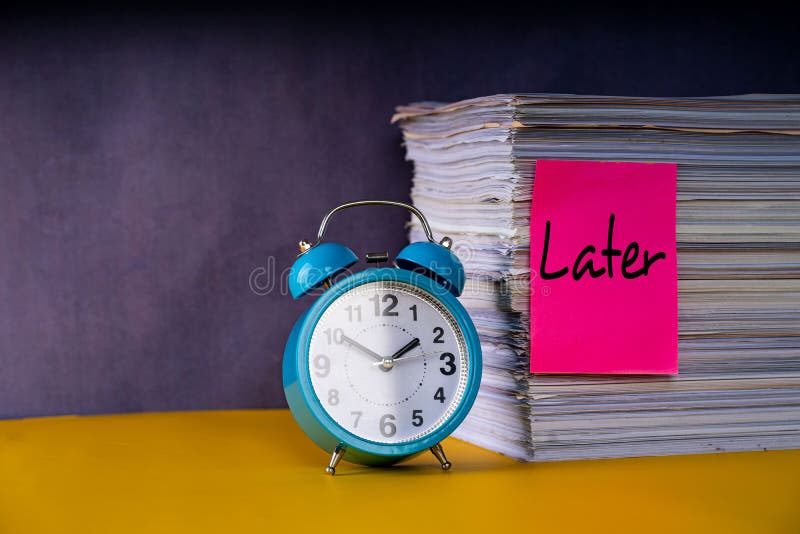Concept of Procrastination, an Alarm Clock Next To a Stack of Papers ...