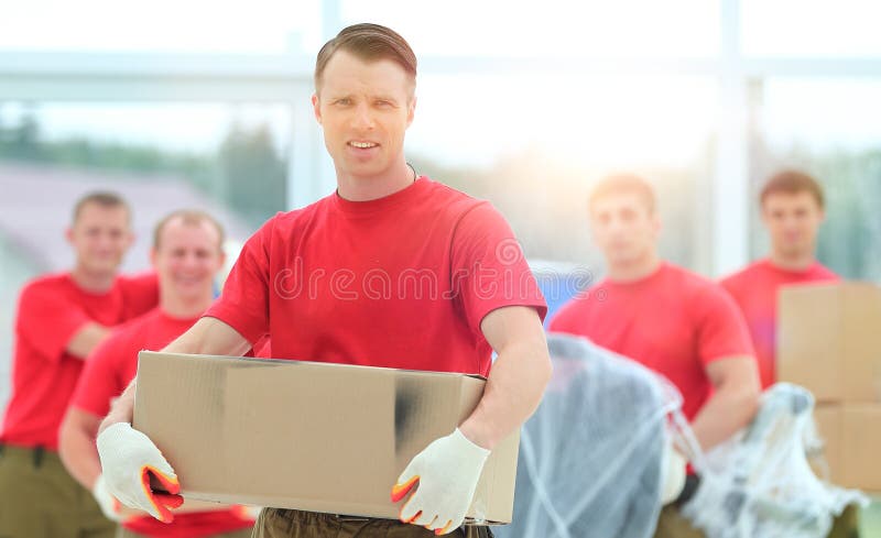 Foreman and Workers with Boxes of Building Materials Stock Image ...