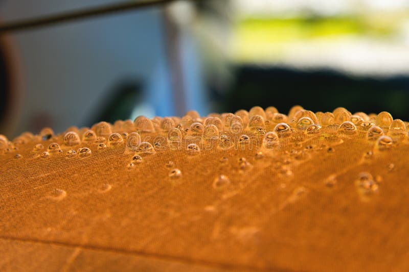 Concept of Raindrops Falling on Yellow Background. Abstract Wet Surface ...