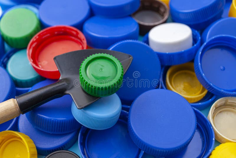 The Concept of Recycling Plastic Bottle Caps. Plastic Cover on a Small ...