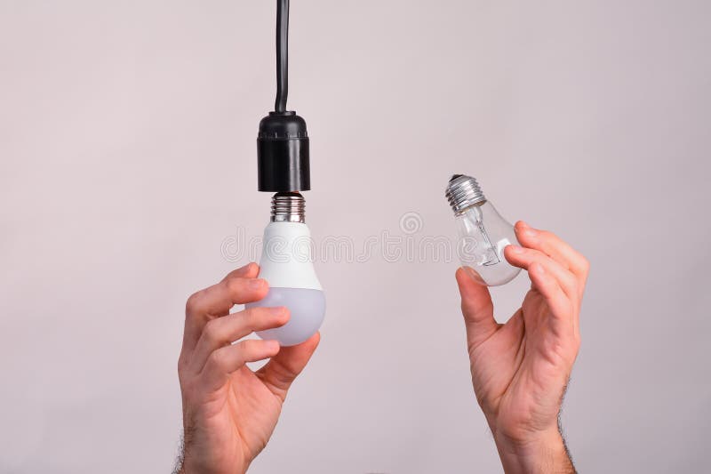 The Concept of Replacing an Incandescent Light Bulb with an LED Lamp ...