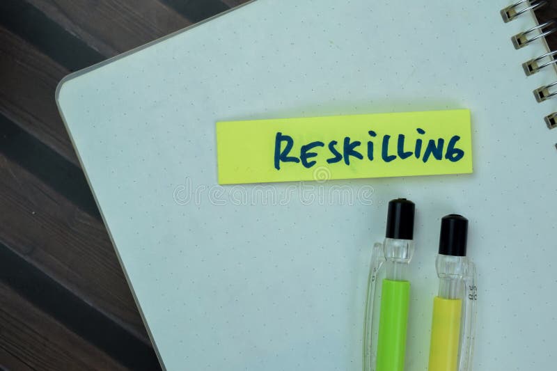 Concept of Reskilling Write on Sticky Notes Isolated on Wooden Table ...