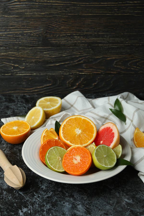 Concept of Ripe Food with Different Citrus on Black Smoky Table Stock ...
