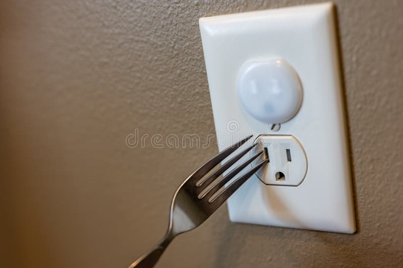 Selective Focus on Edge of a Metal Fork about To Be Inserted into an ...