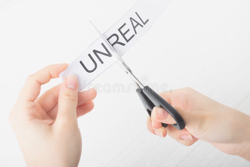 The Concept of Self-confidence. Female Hands Cut with Scissors the Word ...