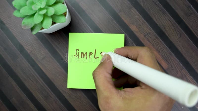 Concept Of Simple Things Write On Sticky Notes Isolated On Wooden Table