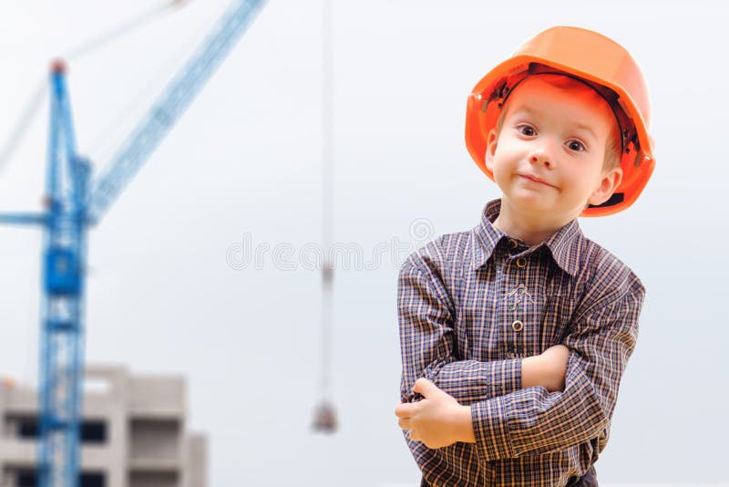 Concept, Small Boy in a Helmet, Looking Construction Site with Cranes ...