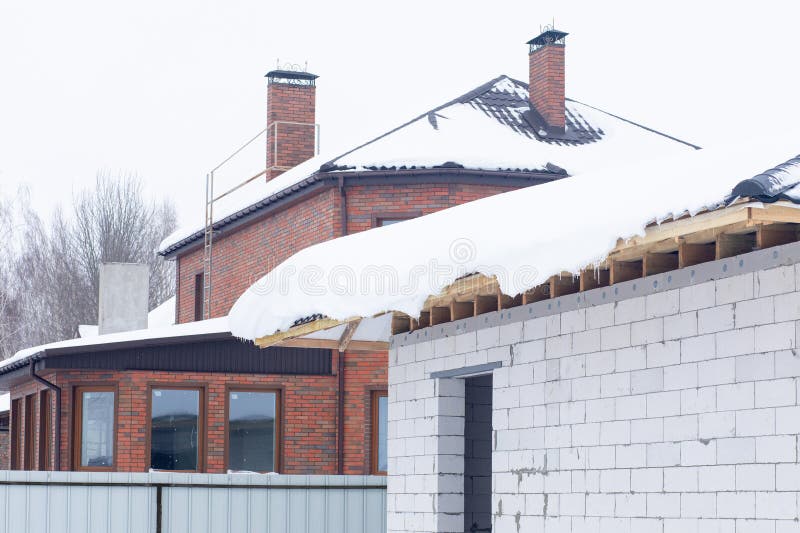 Concept of Snow Load on a Cottage Under Construction Stock Photo ...
