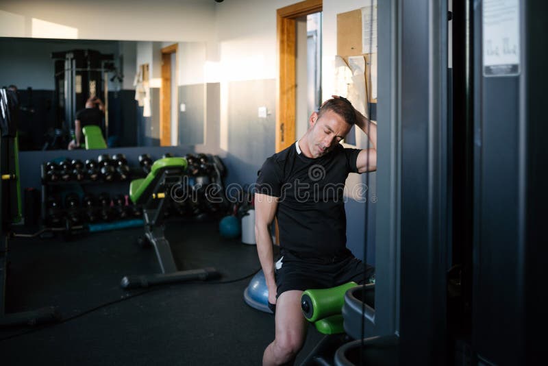 Concept: Sport. Athlete Man In The Gym. Stretching The Neck ...