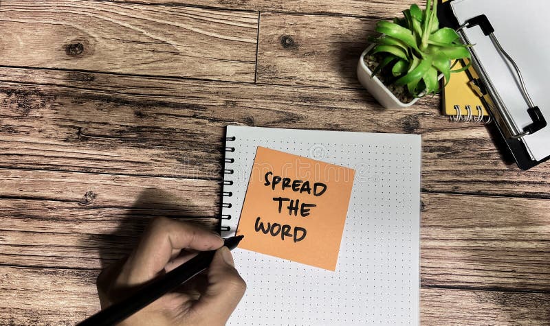 Concept of Spread the Word Write on Sticky Notes Isolated on Wooden ...