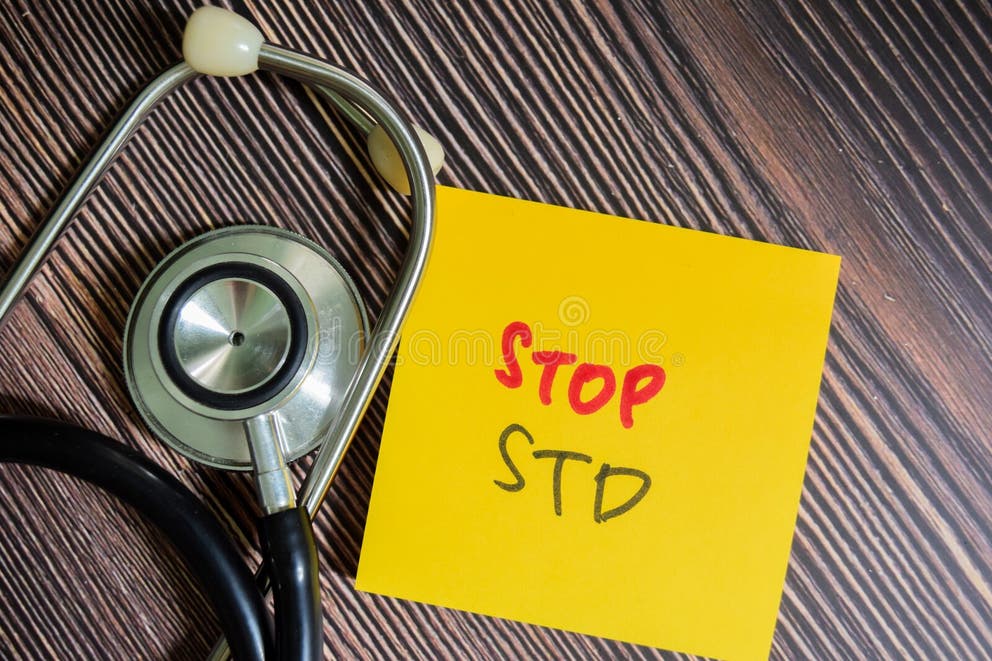 Concept of Stop STD Write on Sticky Notes Isolated on Wooden Table ...
