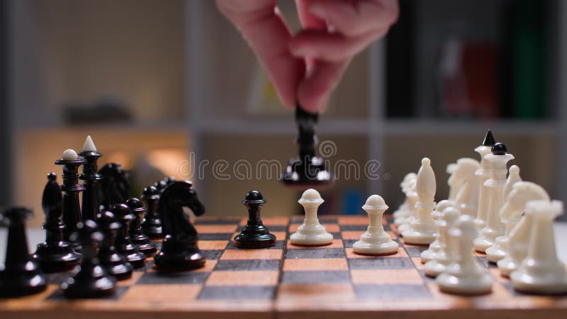 Concept of Strategy and Planning, a Man with a Chess Piece Plays on a ...