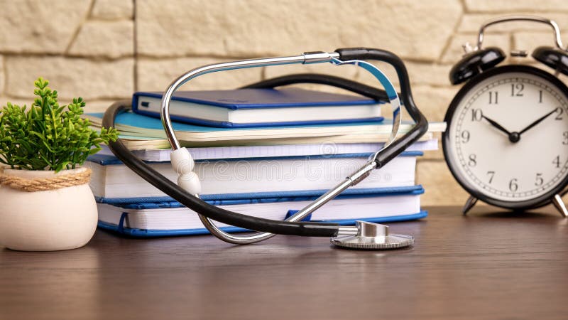 Concept of Studying Medicine. Stethoscope with a Stack of Books and a ...