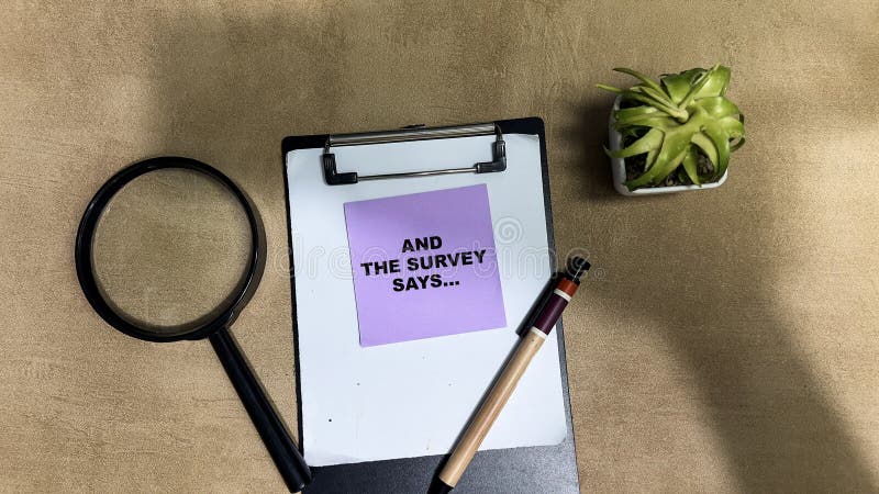 Concept of and the Survey Says Write on Sticky Notes Isolated on Wooden ...